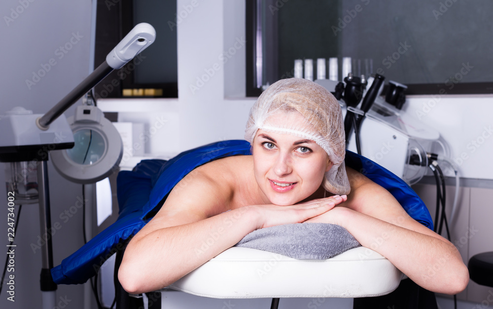 Female during body procedure in cosmetology office Stock Photo | Adobe ...