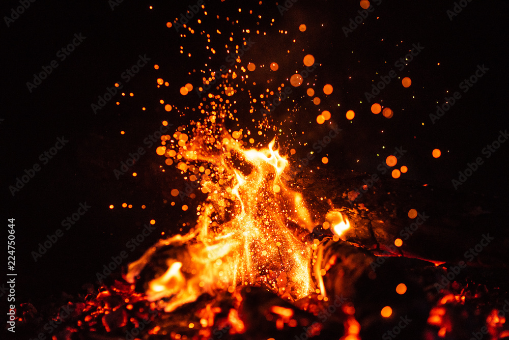 Fiery fire isolated on black isolated background . Beautiful yellow ...