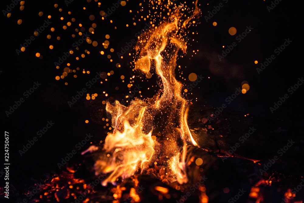 Fiery fire isolated on black isolated background . Beautiful yellow ...