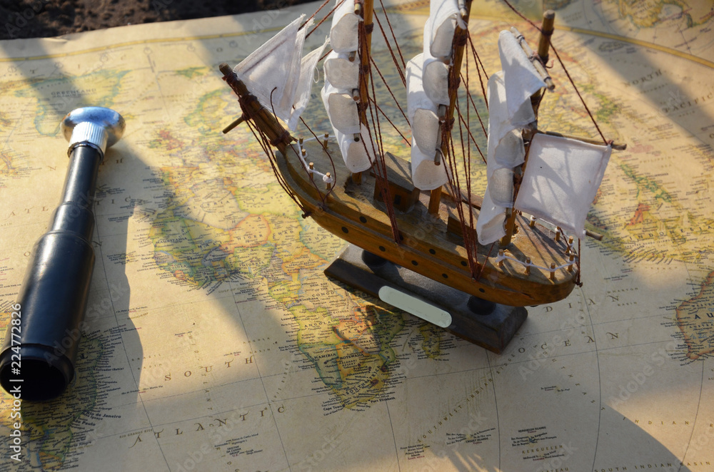 old ship sailboat on an old vintage map, a shameful pipe, the concept ...