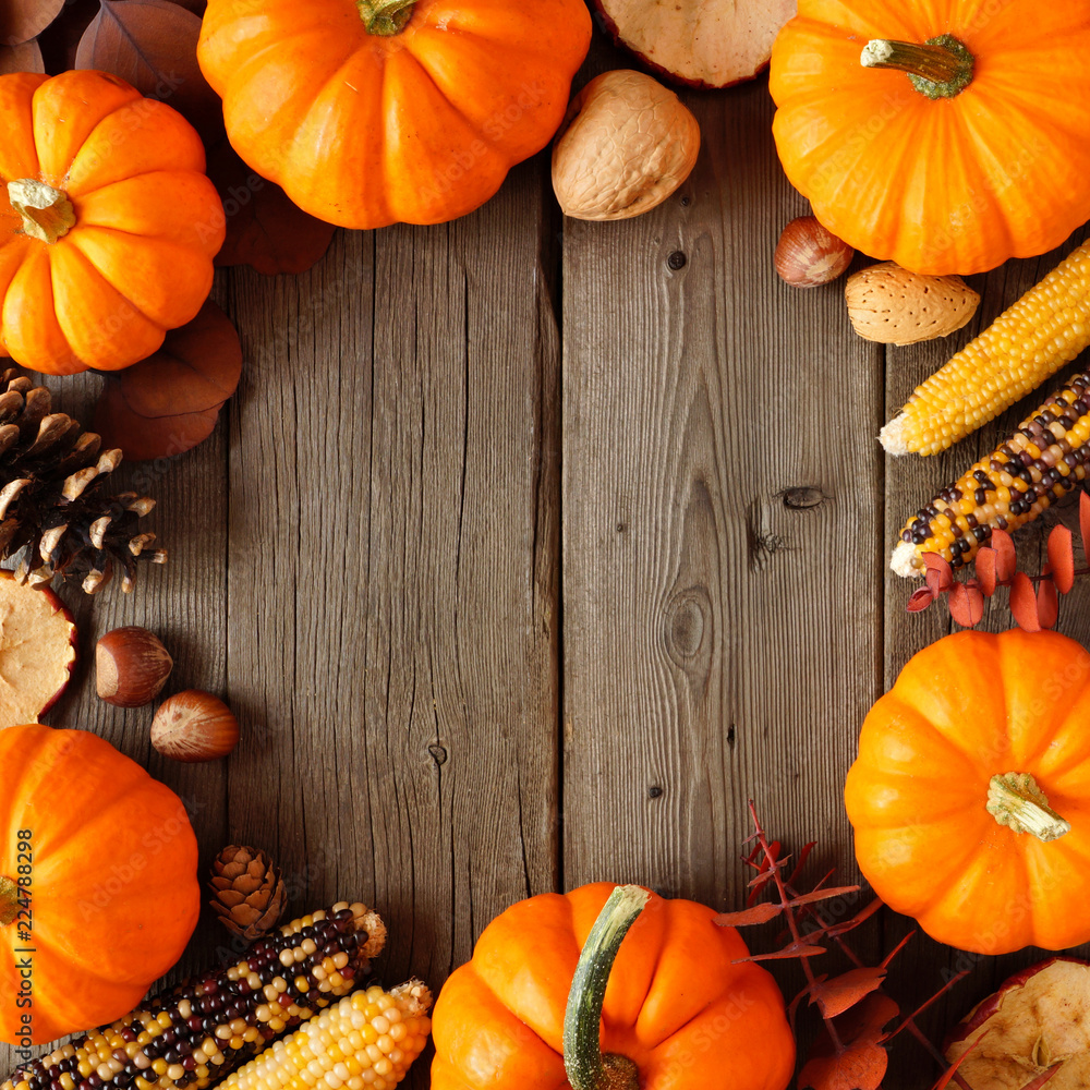 Autumn square frame of pumpkins and fall decor on a rustic wood ...