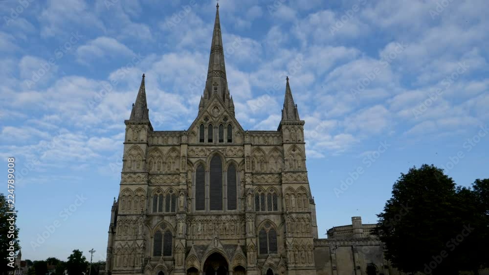 High light cloud drift slowly by spire of Salisbury Cathedral built ...