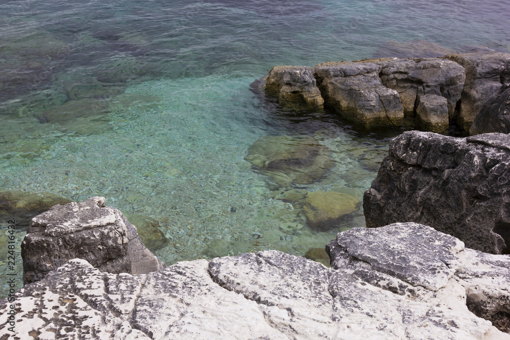 background image of rocky seashore on different Islands of Greece ...