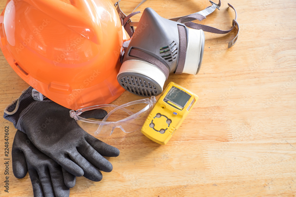 Standard personal protective equipment on wooden table. top view ...