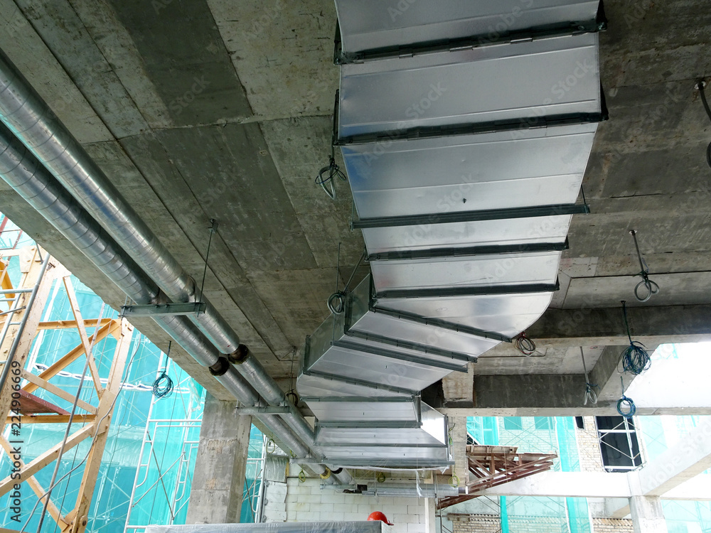 Air-condition and ventilation duct installed by construction workers at ...