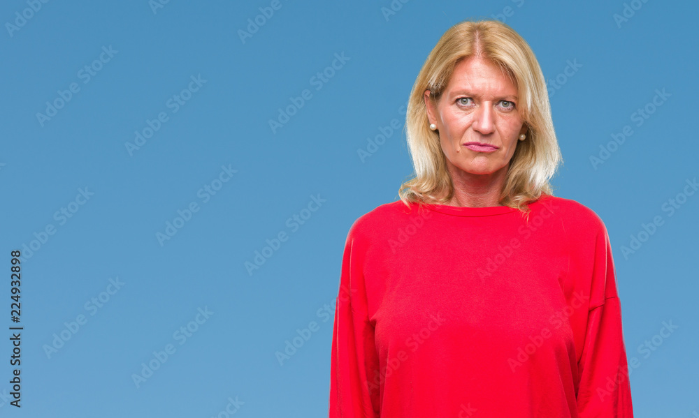 Middle age blonde woman over isolated background depressed and worry ...