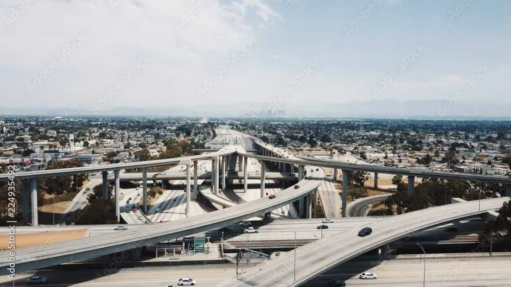 Drone flying forward over epic multiple level highway intersection in ...