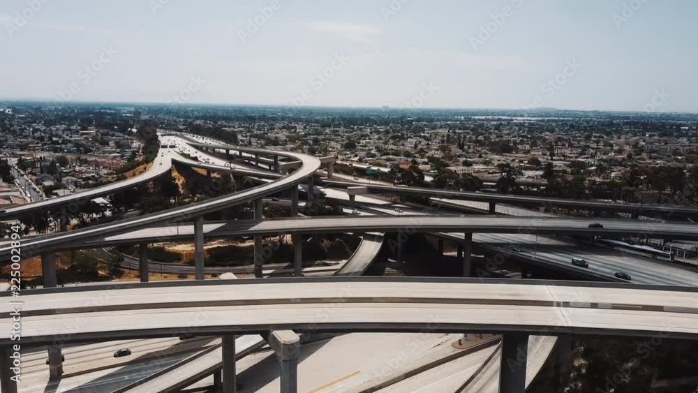 Drone flying right over multiple levels of epic highway junction ...