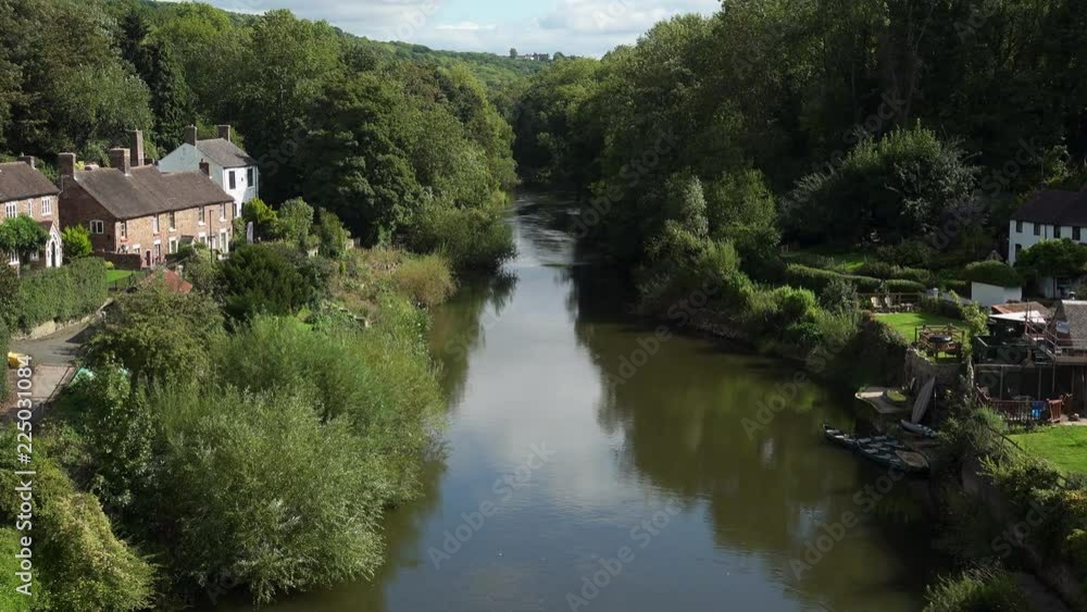 Cottages on the banks of the steep river Severn Gorge at Ironbridge the ...