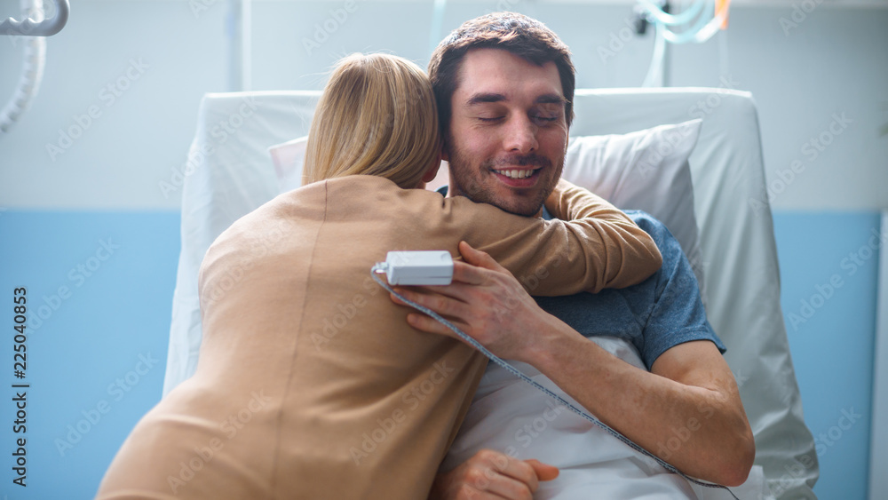In the Hospital, Man Recovering from Illness Lying in Bed, Loving Wife ...