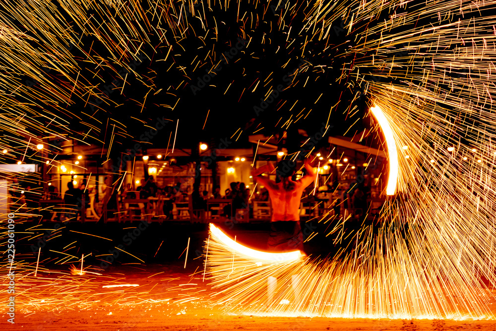 fire dance on beach near the sea , the east coast of thailand Stock ...