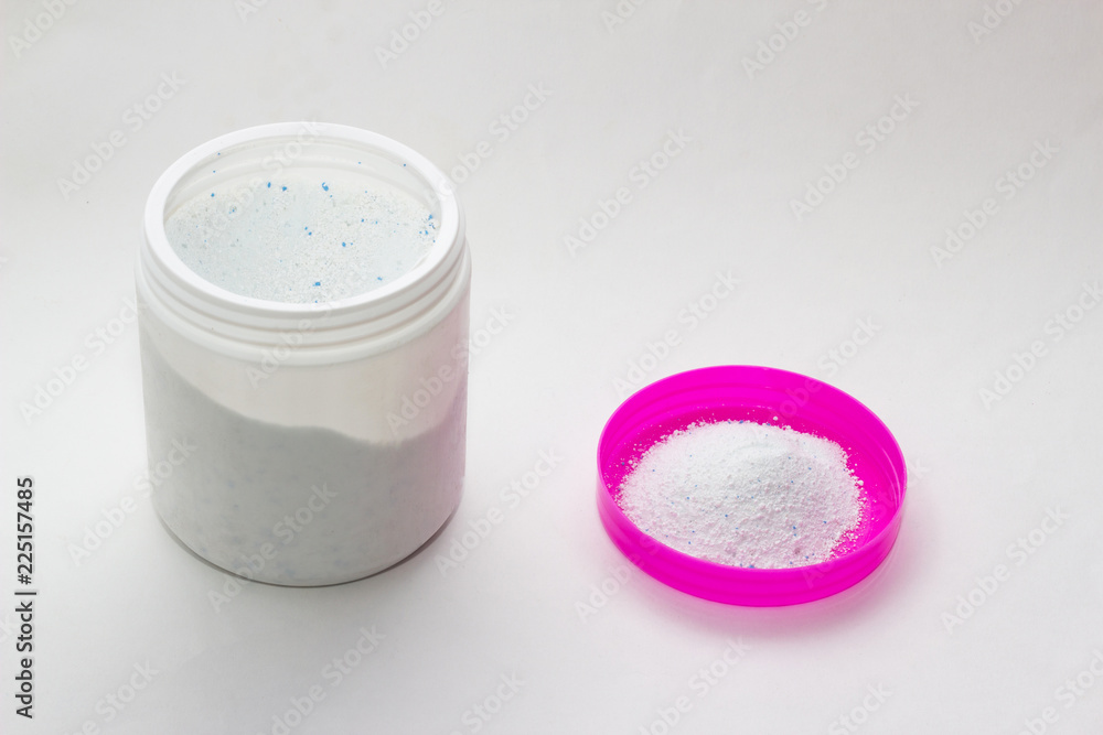 Container with stain remover on a white background, close-up, stain ...
