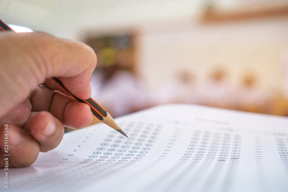 Students hands taking exams, writing examination room with holding ...