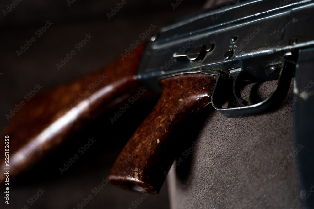 Low key photo of AK-47 Kalashnikov rifle. Dark themed automatic rifle ...