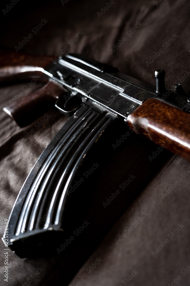 Low key photo of AK-47 Kalashnikov rifle. Dark themed automatic rifle ...