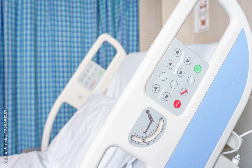 Hospital bed remote control hanging on the bed rail. technology of ...