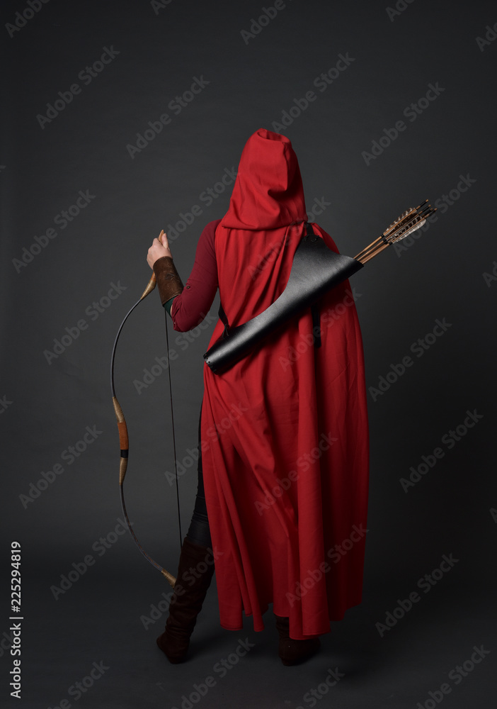 full length portrait of brunette girl wearing red medieval costume and ...