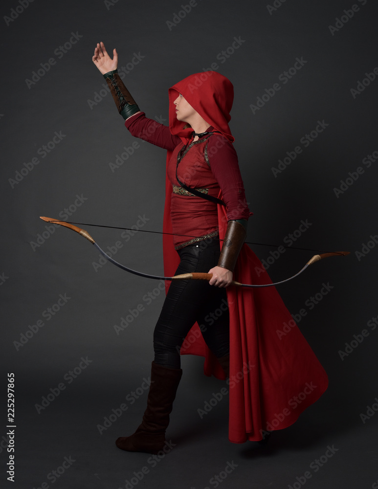 full length portrait of brunette girl wearing red medieval costume and ...