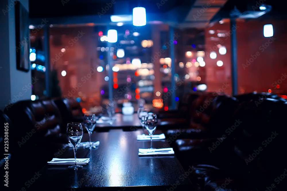 nightclub penthouse in a skyscraper / table setting with glasses and ...