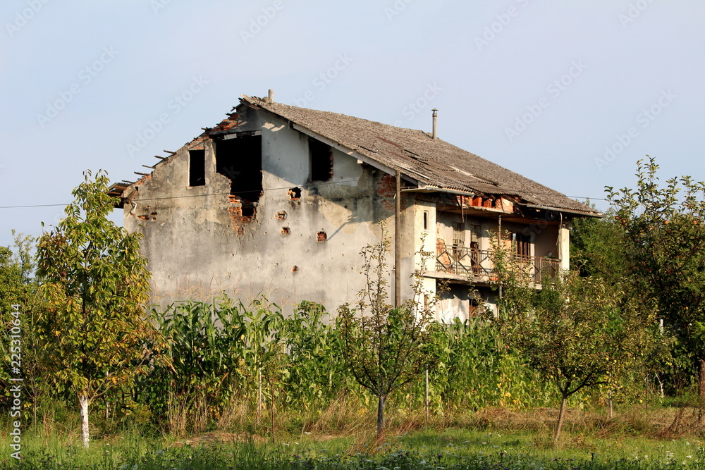 Family house abandoned after war left with damaged exterior and ...