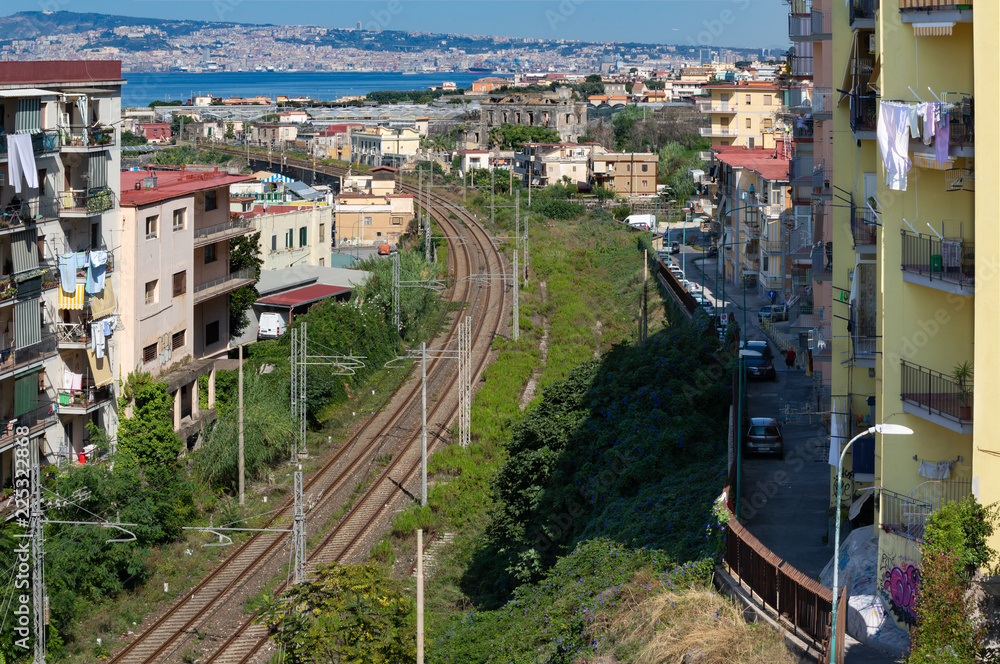 View of a neighborhood with buildings and railway of Torre del Greco ...