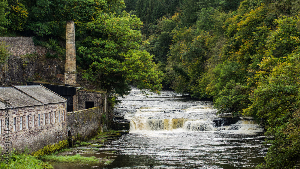 Waterfall at the historic village of New Lanark. A World Heritage Site ...