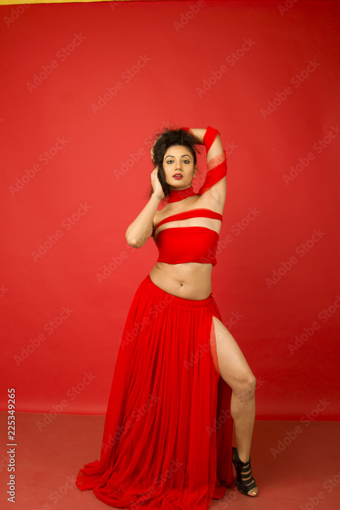 beautiful indian female model in a red flowy dress Stock Photo | Adobe ...