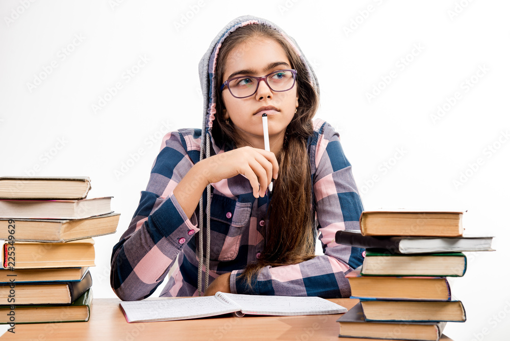 Girl with books. student is sitting at the table with books. student at ...