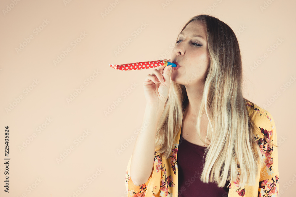 Beautiful Young Girl Blowing In A Party Blower Cute And Funny Model