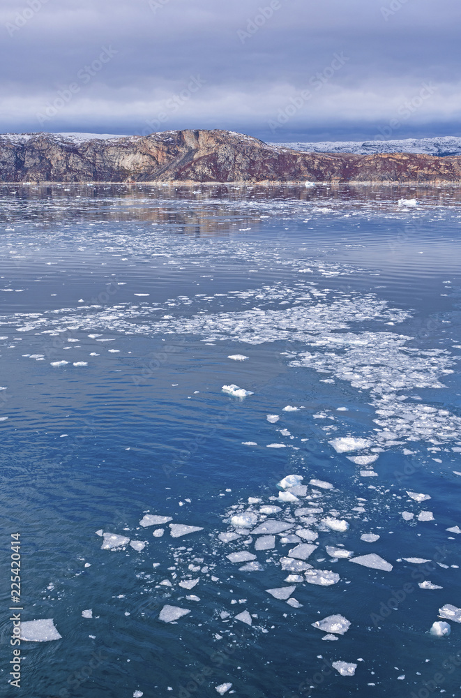 Bare Rocks and Floating Ice in the Arctic Stock Photo | Adobe Stock