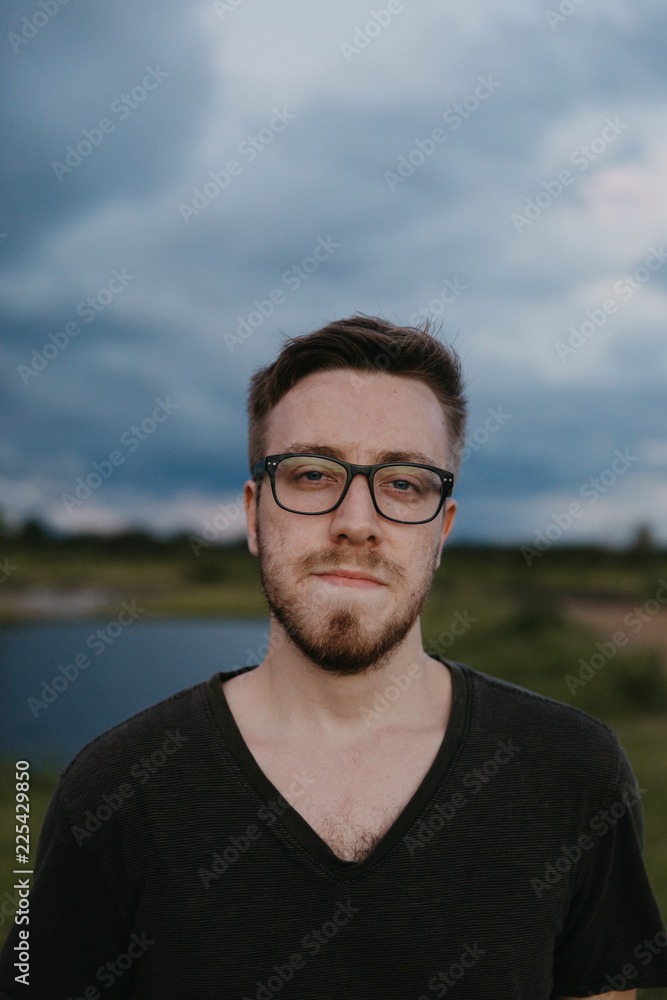 Handsome Young Male Model in Glasses and V-neck Modeling in Open Field ...