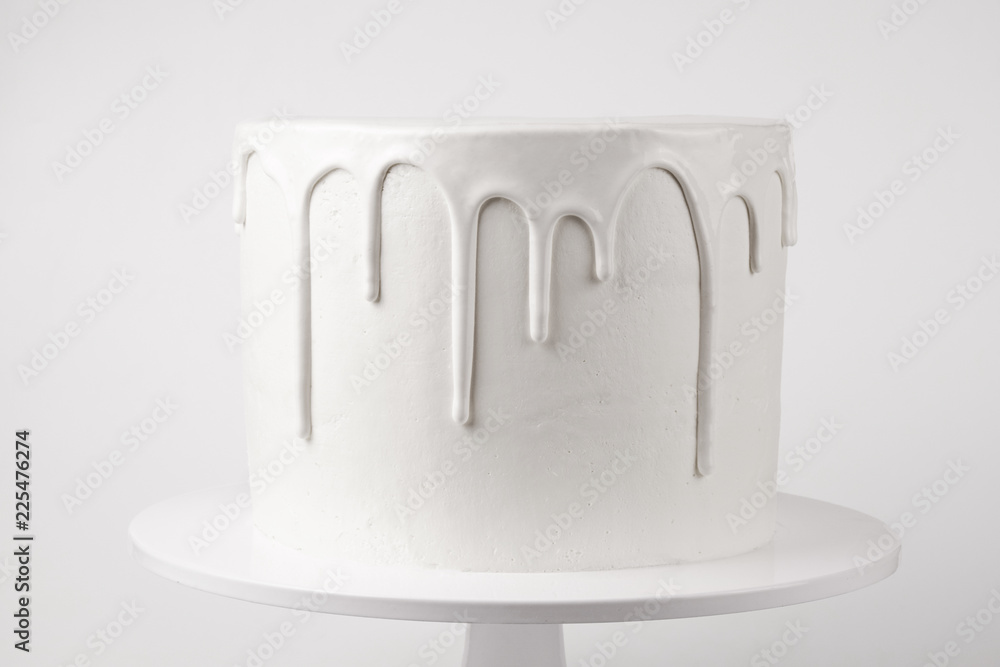 White cake with glaze on a white background. Picture for a menu or a ...