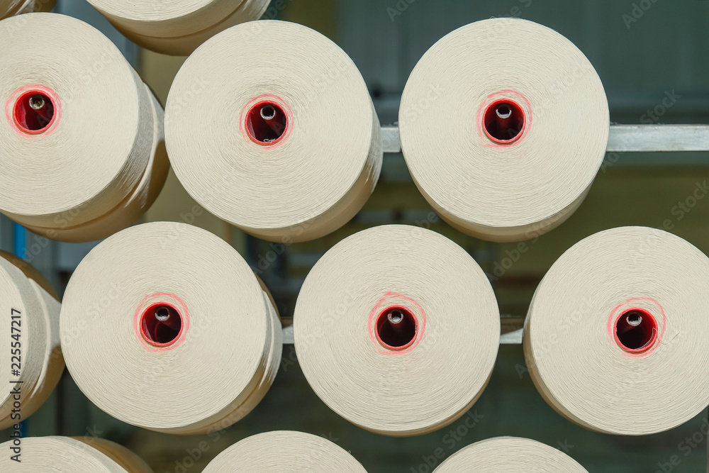Coil with white thread. Production of home textiles. Cotton white ...