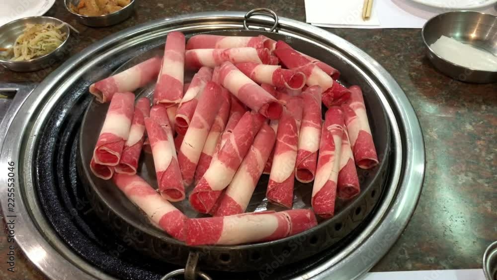 4K HD video of Chadol baegi, a staple of Korean BBQ, a thinly shaved ...