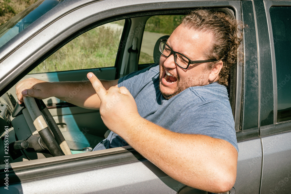 Angry fat man in the car. Road and stress Stock Photo | Adobe Stock