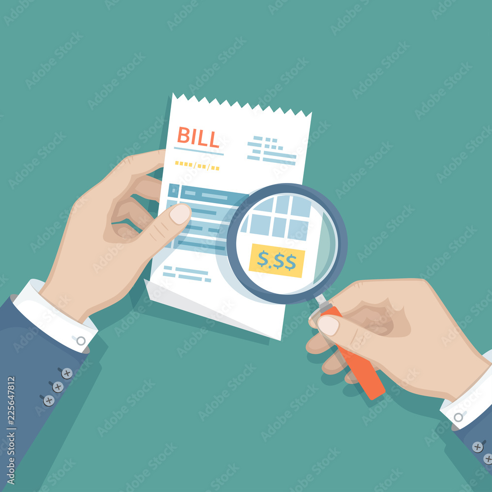 Man's hands with magnifying glass above bill inspects the payment ...