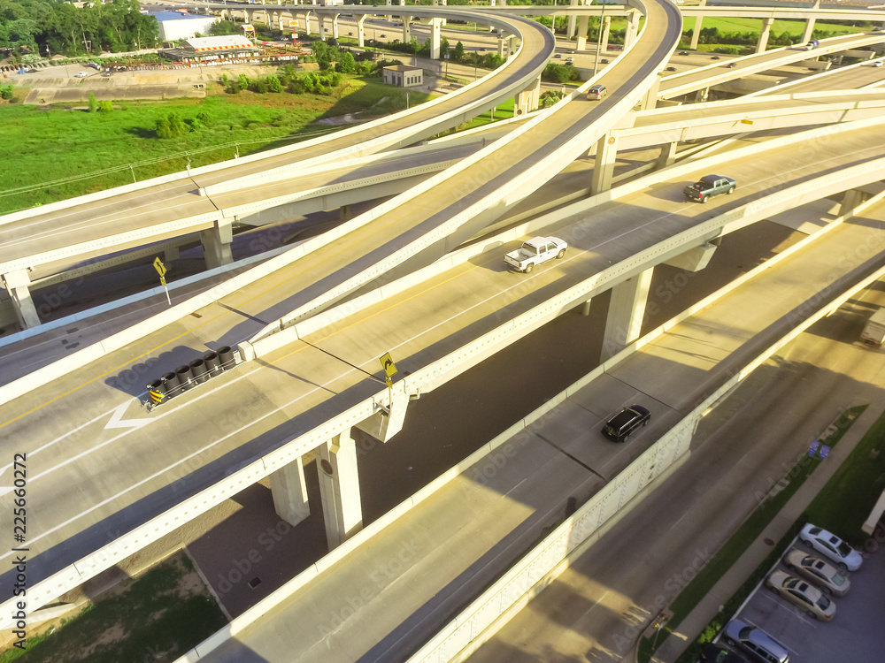 Aerial view massive highway intersection, stack interchange at sunset ...