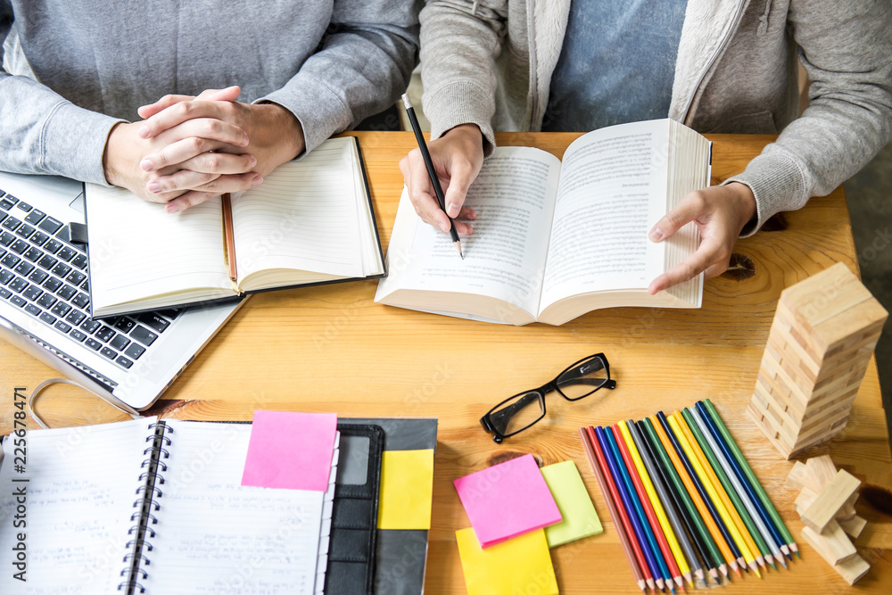 Education, teaching, learning, technology and people concept. Two high ...