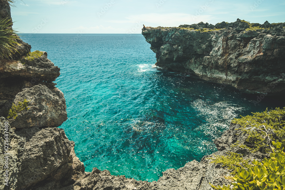 Close-up turquoise bay, vertical cliffs. Indonesia, Sumba island ...