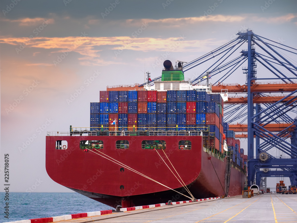 The container vessel during discharging at an industrial port and move ...