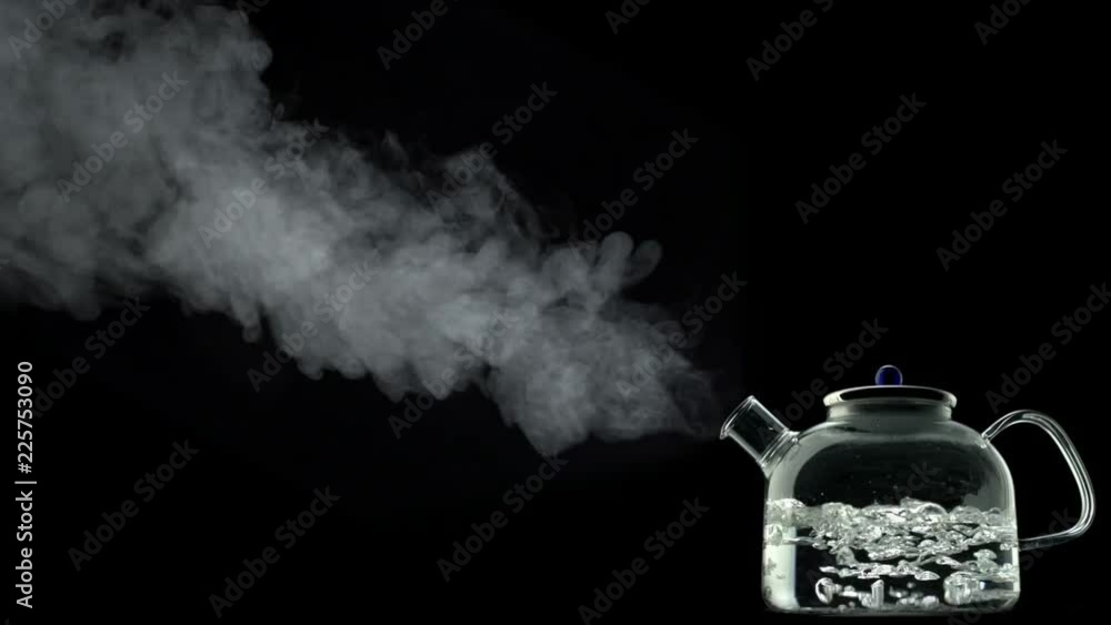 Loop of Boiling water in kettle on black background shooting with high ...