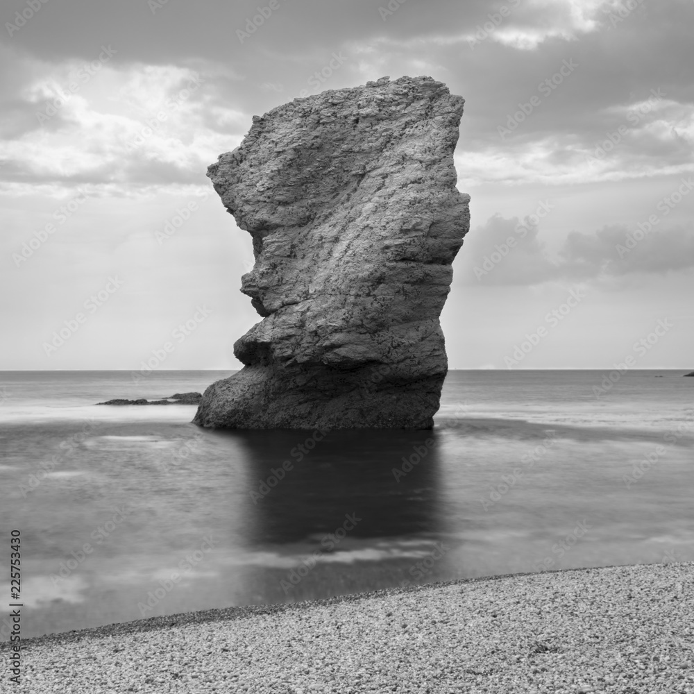 A long exposure view of iconic Butter Rock on the Dorset Jurassic Coast ...