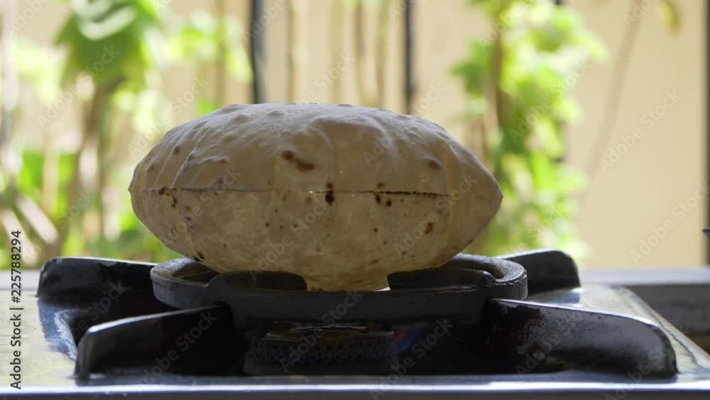 footage of making of Phulka a kind of Chapati: Indian thin bread made ...