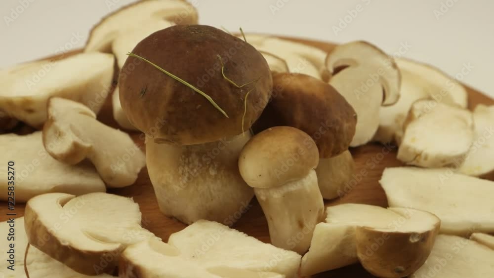 Whole cep and cross-section of the ceps on the wooden cutting board ...
