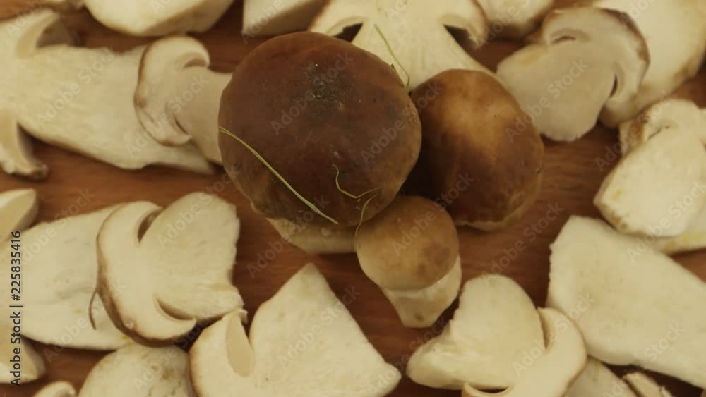Whole cep and cross-section of the ceps on the wooden cutting board ...