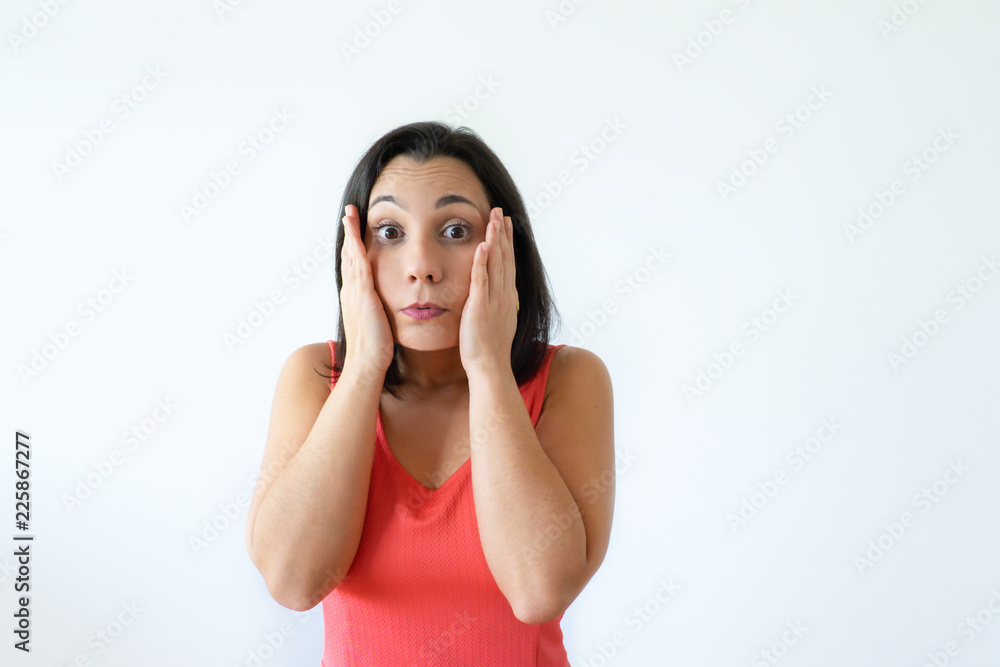 Beautiful shocked Indian woman touching face with both hands ...