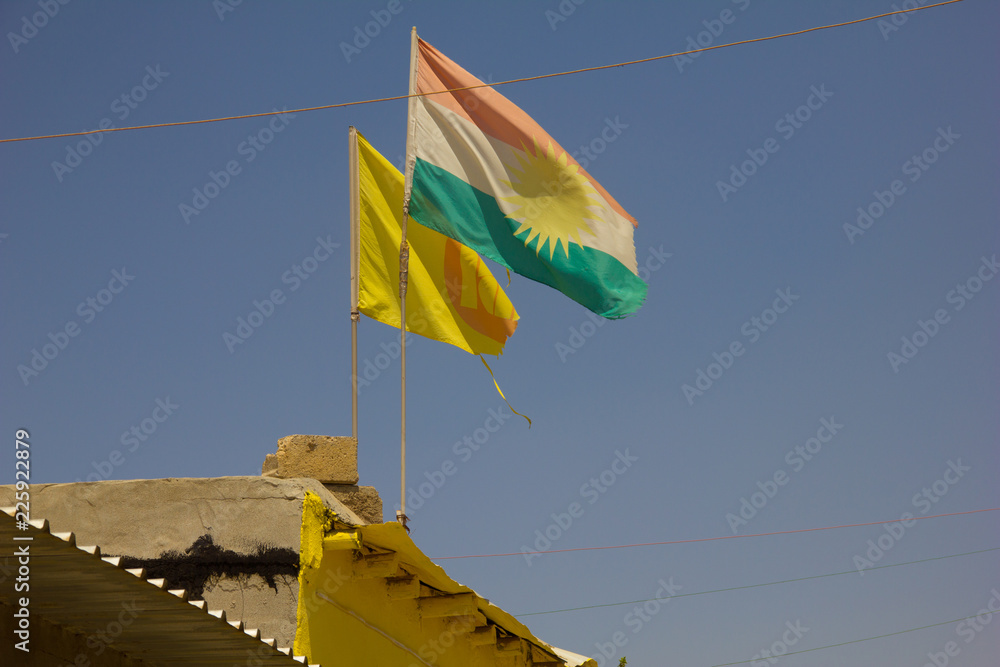 Kurdistan flag flying on top of colorful refugee home in Erbil, Iraqi ...