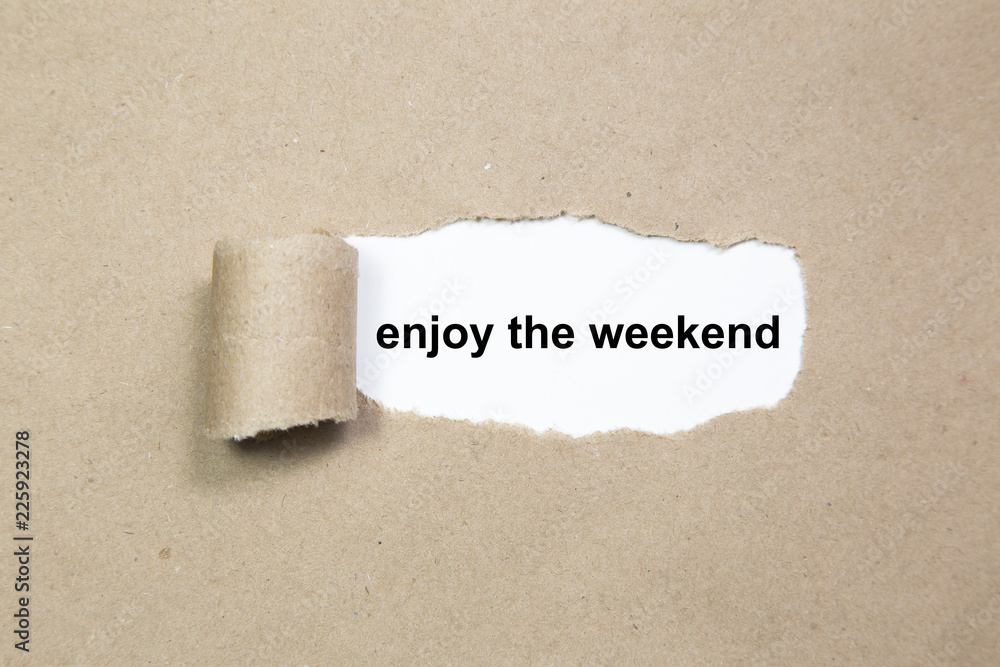 enjoy the weekend text on paper. Word enjoy the weekend on torn paper ...