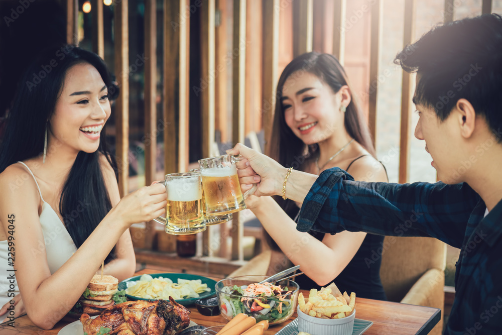 Teenager asian people having fun at drinking with cheering with beer at ...