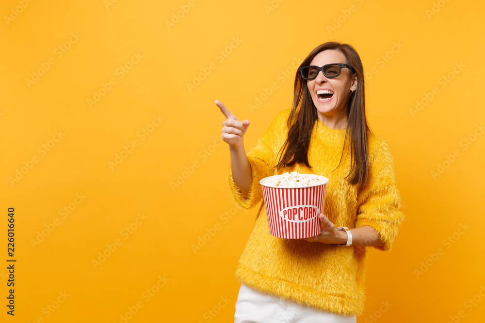 Laughing young girl in 3d imax glasses pointing index finger, watching ...